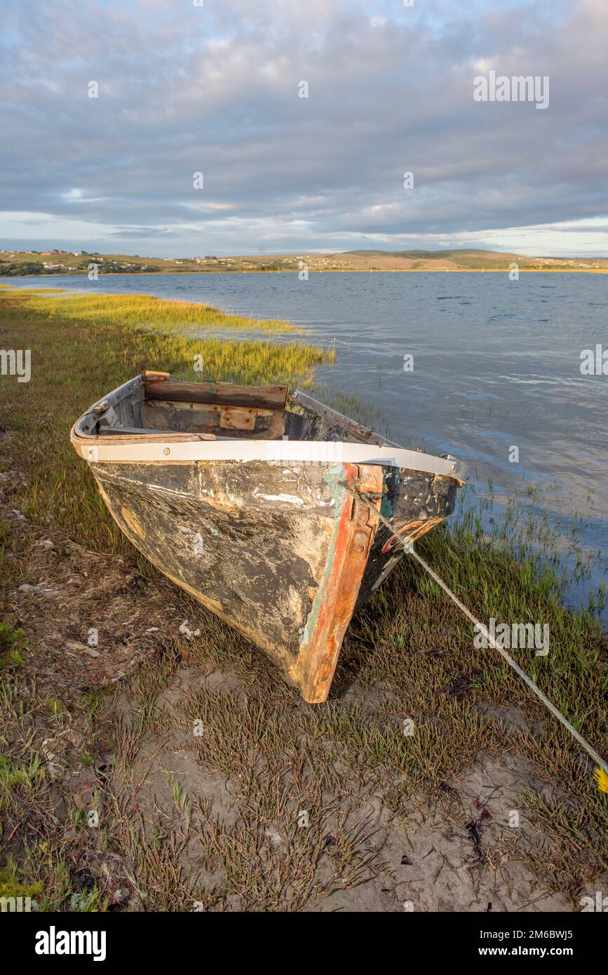 Old hull of motor boat on river bank Stock Photo - Alamy