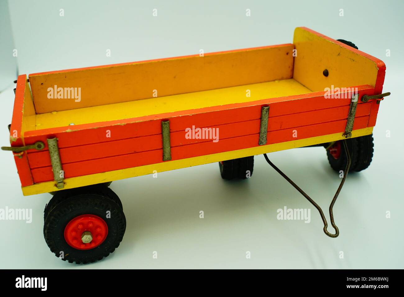 A high-angle shot of a small toy truck trunk isolated on an empty white ...