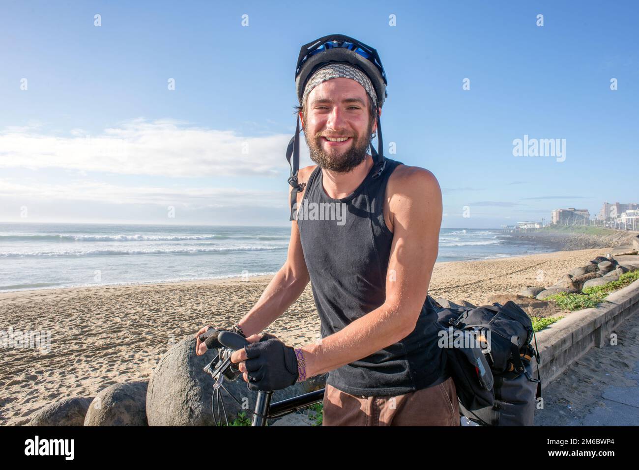 Touring Cyclist with Bicycle by Beach Stock Photo - Alamy