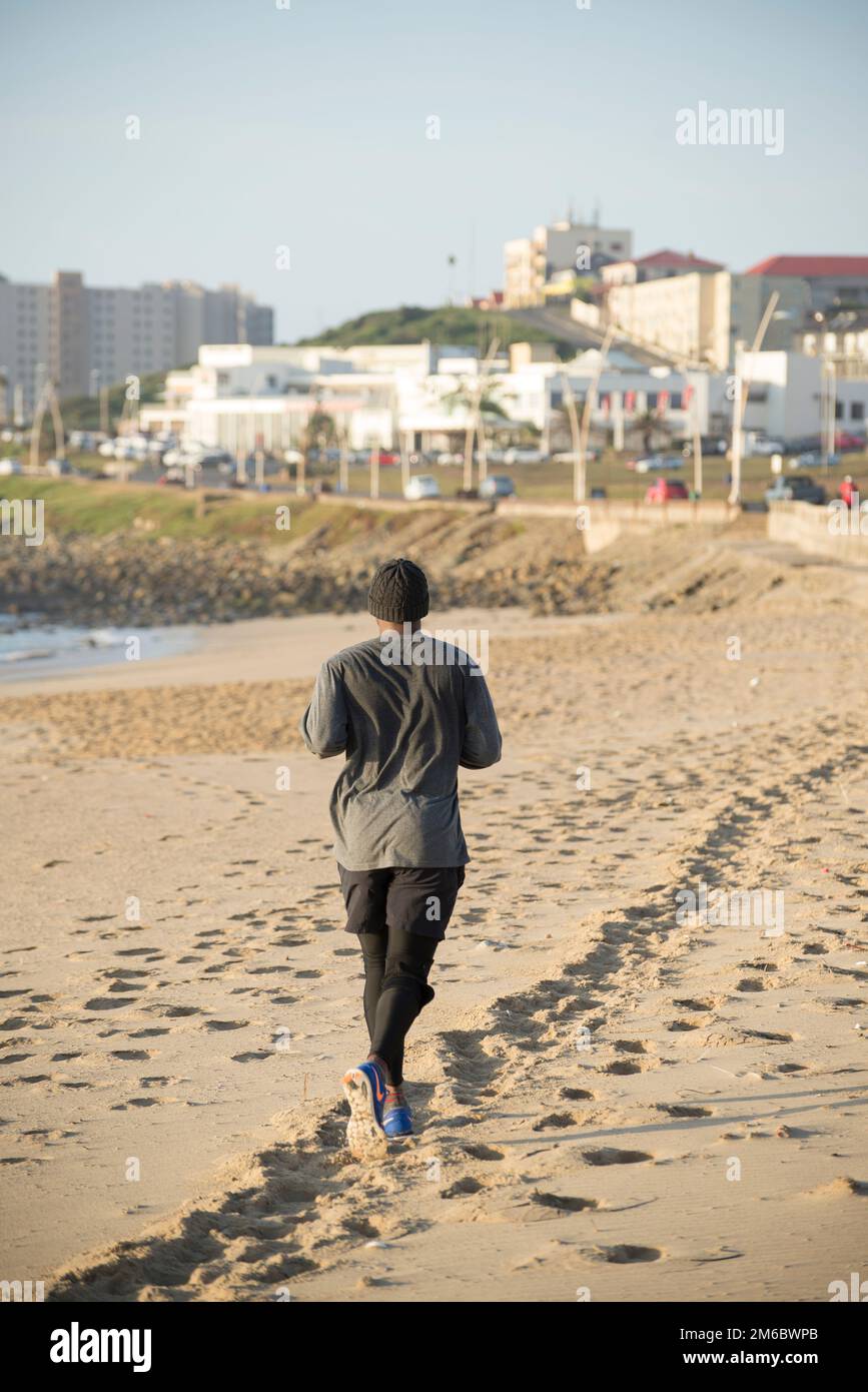 Black man jogging beach hi-res stock photography and images - Alamy
