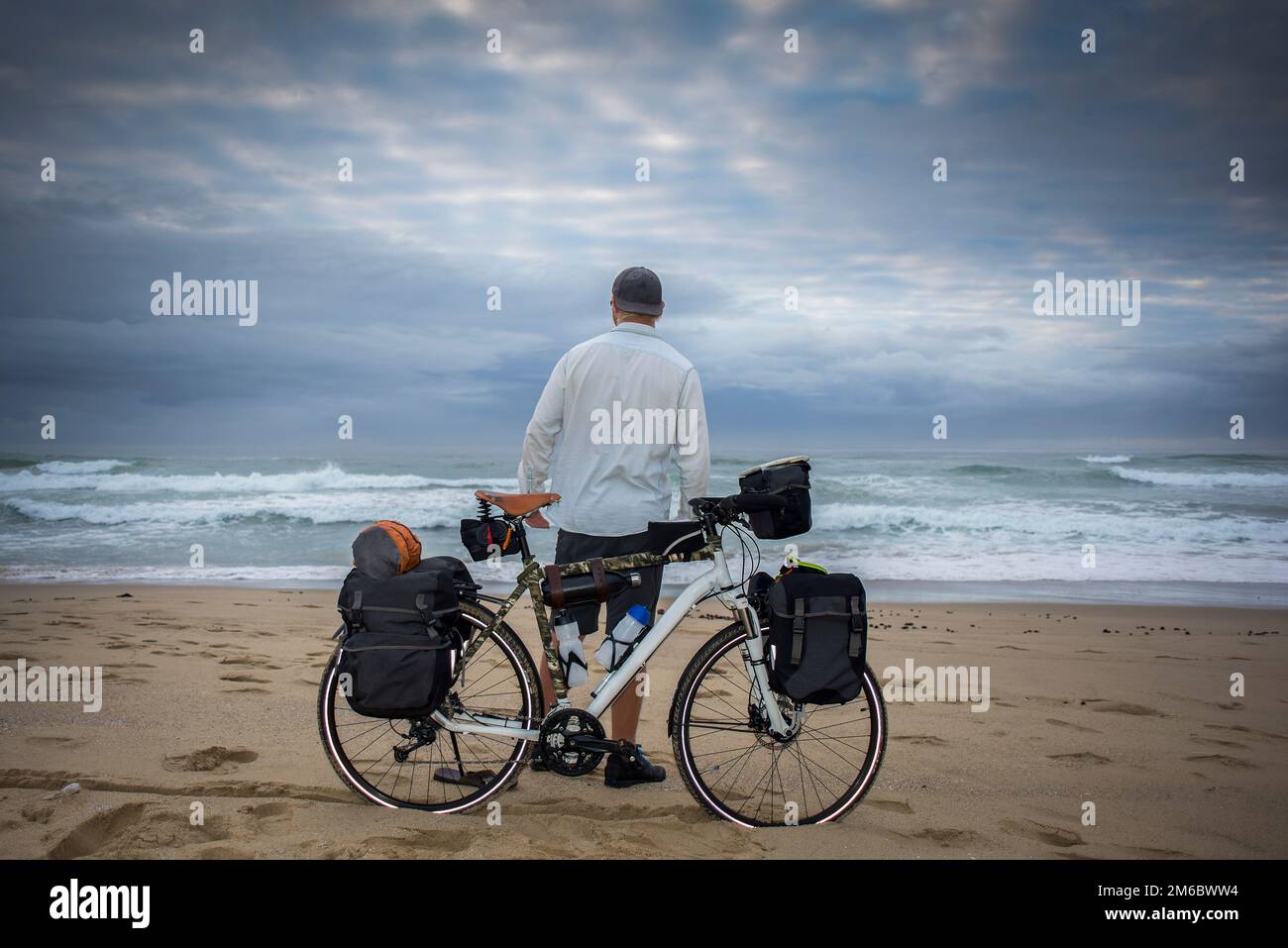 Long Distance Cyclist on beach with Bicycle Stock Photo - Alamy