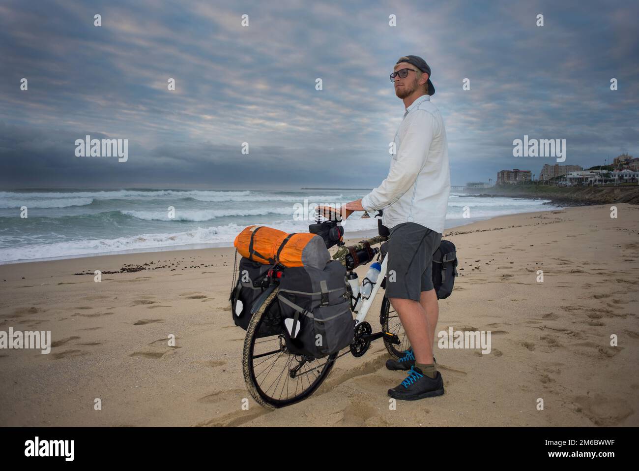 Adventure Cyclist with Bicycle on Beach Stock Photo - Alamy