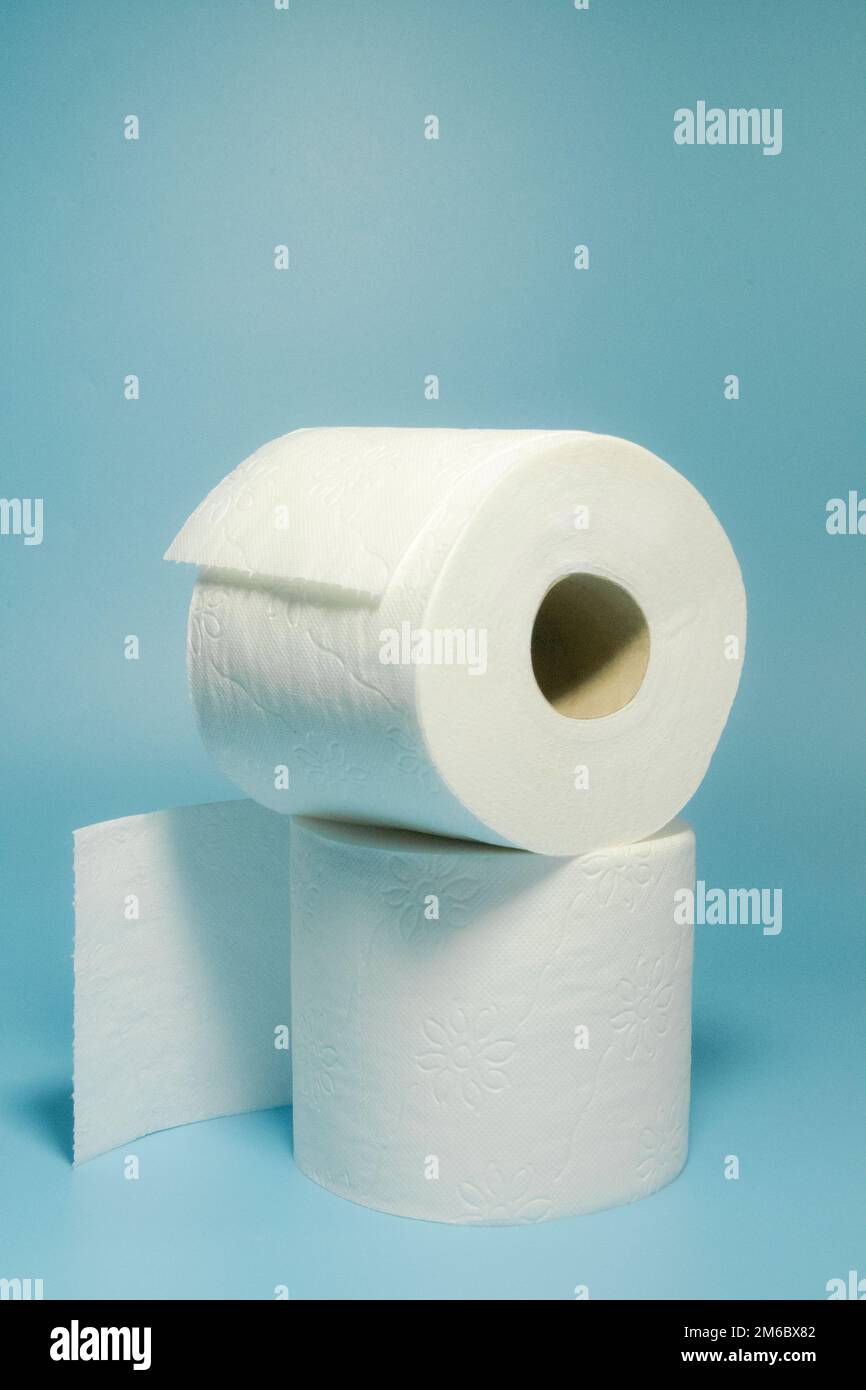 Toilet paper. two rolls on blue Stock Photo - Alamy