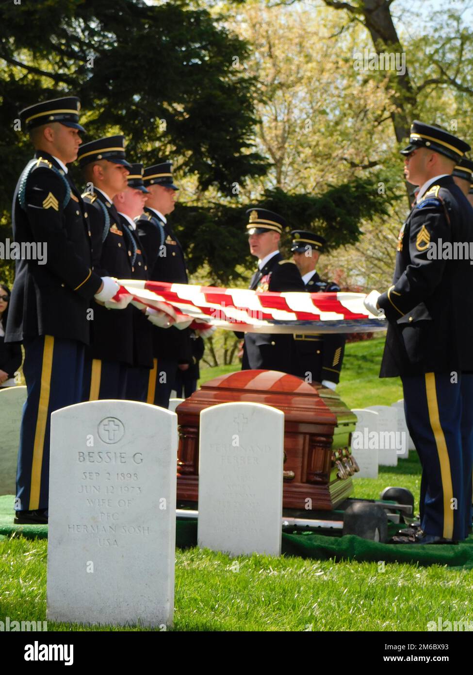 Members of the Army Honor Guard hold the American flag at the funeral ...