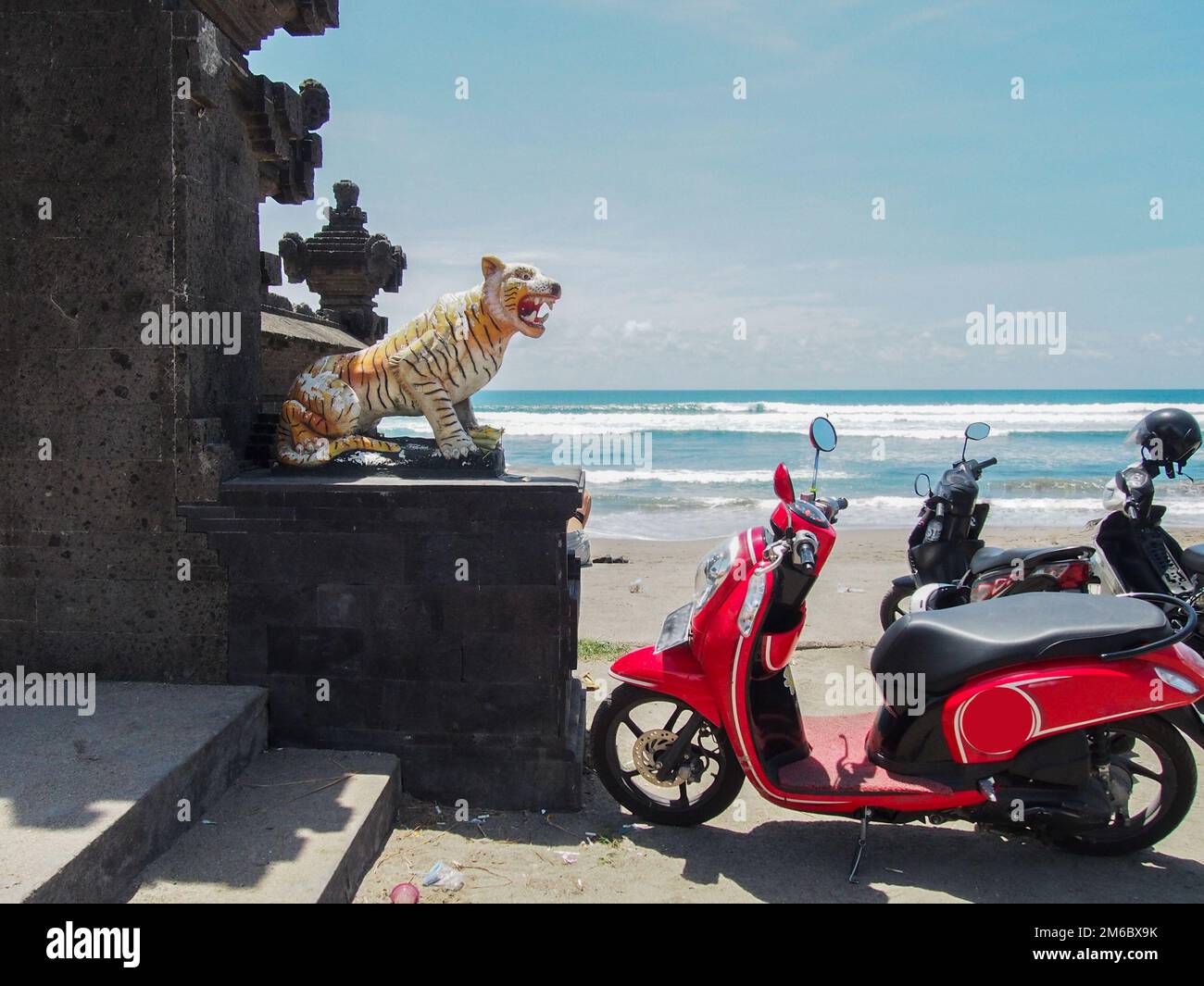 Moped Parked by Temple at Beach in Bali Stock Photo - Alamy
