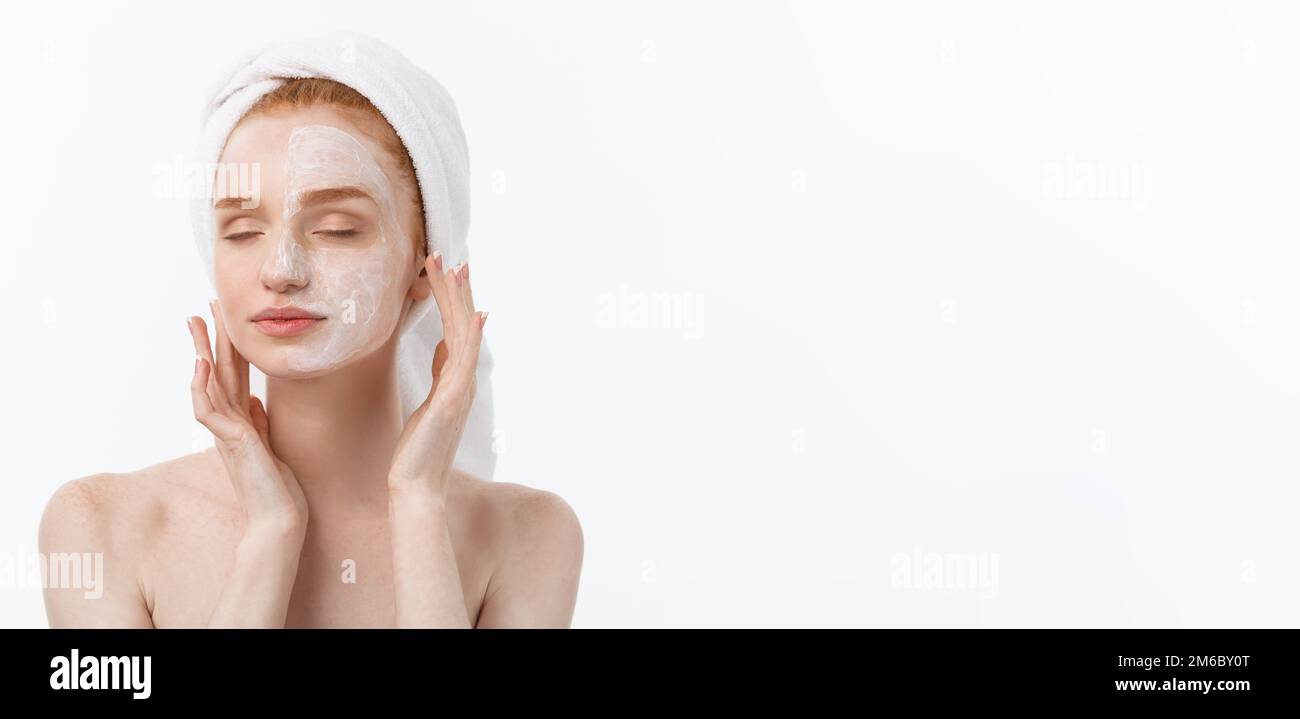 beautiful model applying cosmetic cream treatment on her face on white Stock Photo - Alamy
