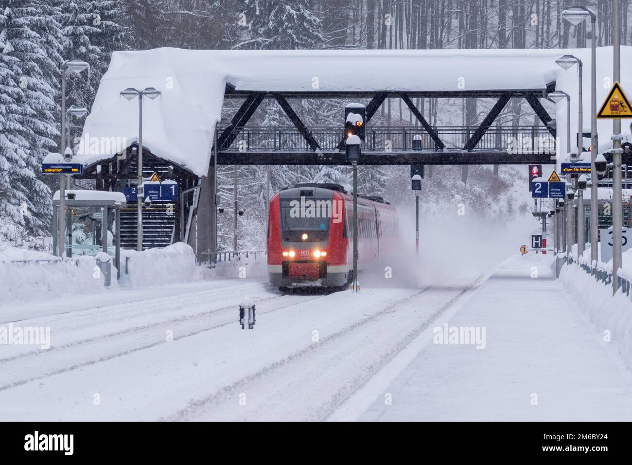 Passenger train in winter at snowfall, Gehlberg, Thuringia, Germany ...