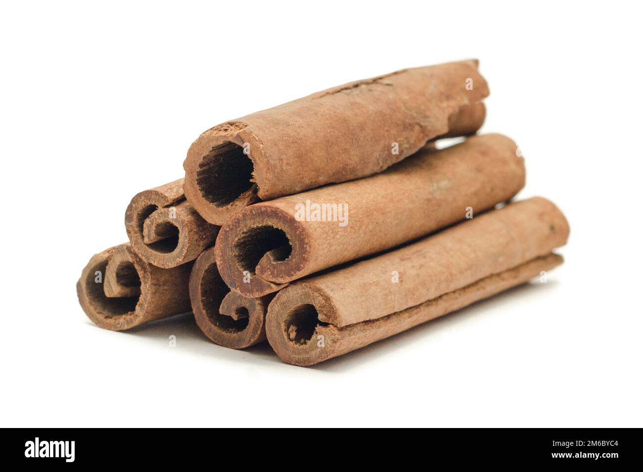 Group cinnamon, close up, isolated on white background Stock Photo - Alamy