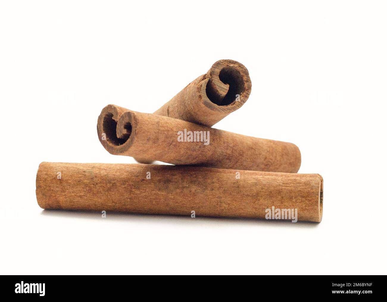 Group cinnamon, close up, isolated on white background Stock Photo - Alamy