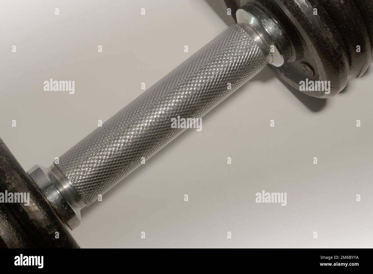 Dumbbell collapsible close-up textured grip Stock Photo - Alamy