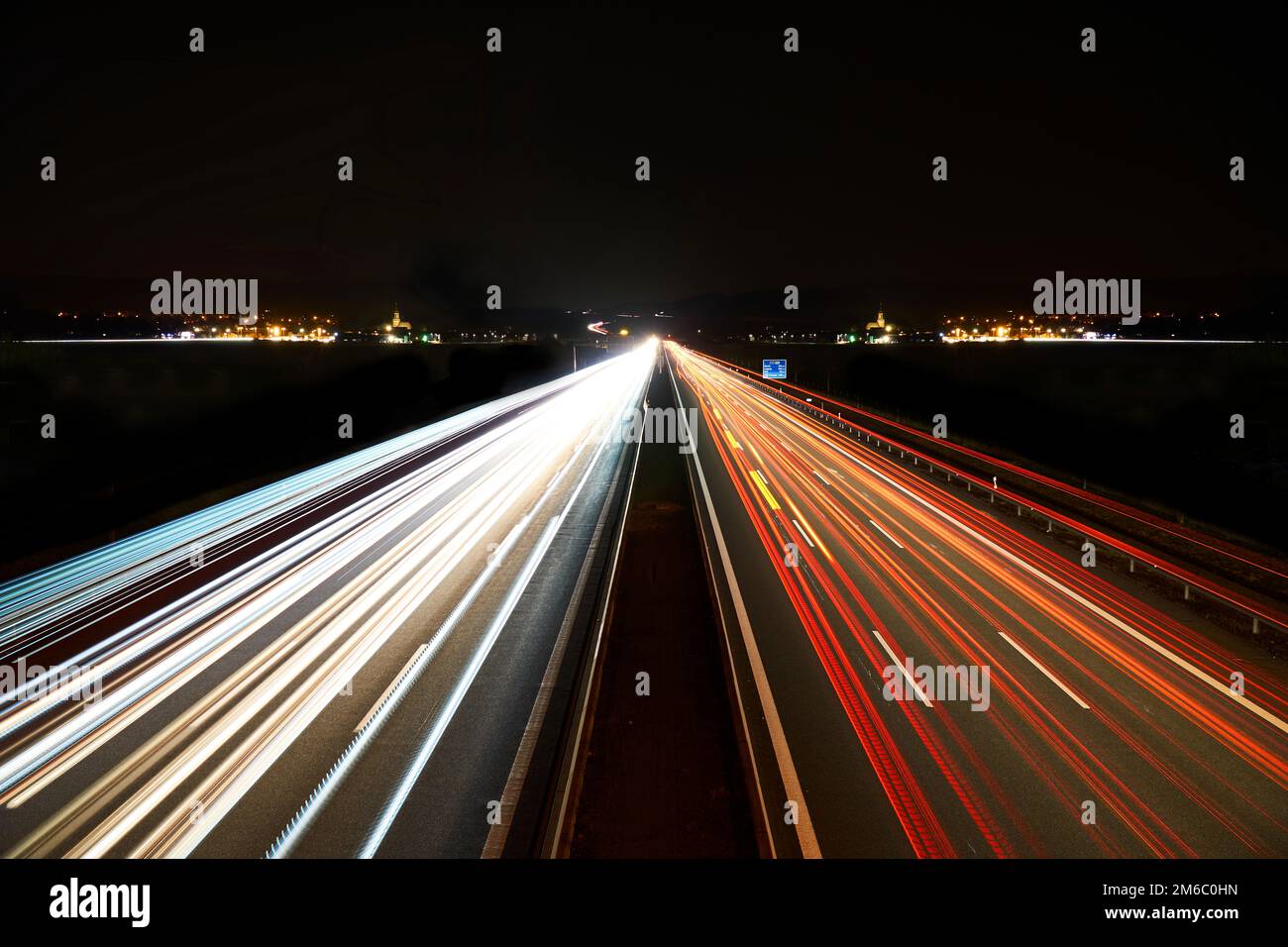 Light trails on highway symmetrical Stock Photo - Alamy