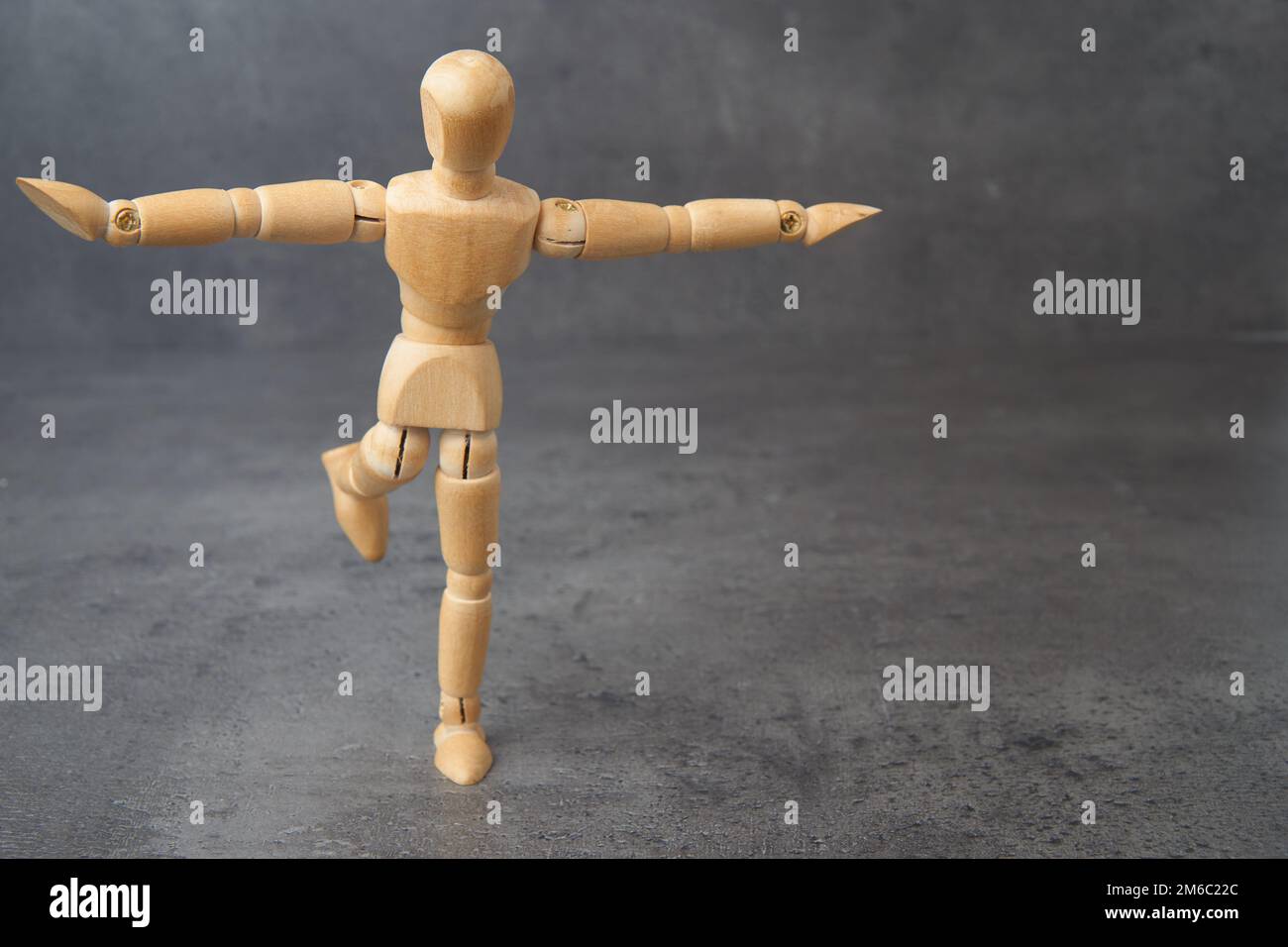 Balancing wooden mannequin, puppet, with copyspace Stock Photo - Alamy