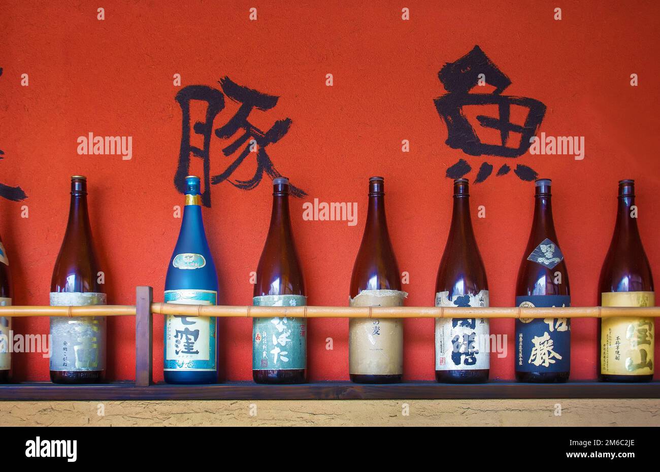 03-29-2015 Kyoto, Japan. Bottles of Shochu, sake on red background (or ...