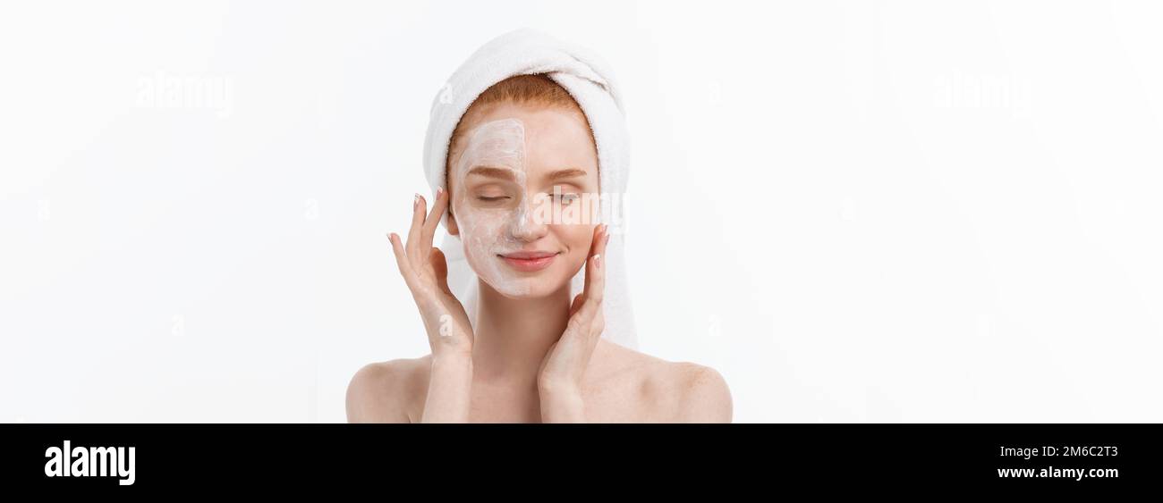 beautiful model applying cosmetic cream treatment on her face on white ...
