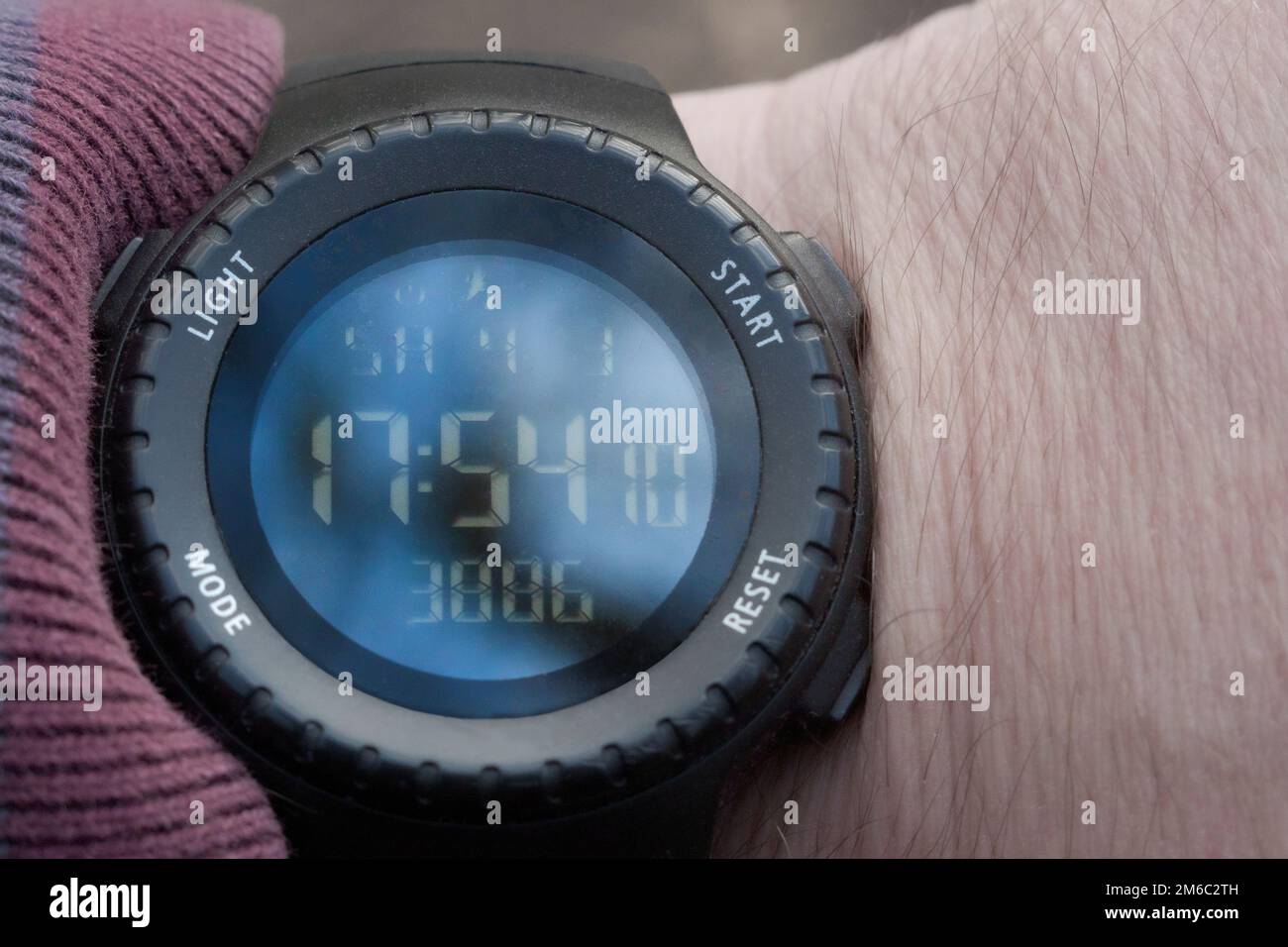 check the time while walking, close-up digital clock Stock Photo - Alamy