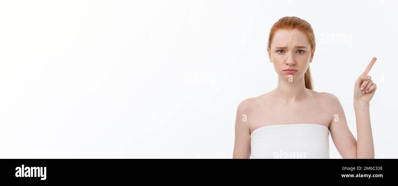 Portrait of caucasian cute in concern and shock, pointing index finger ...