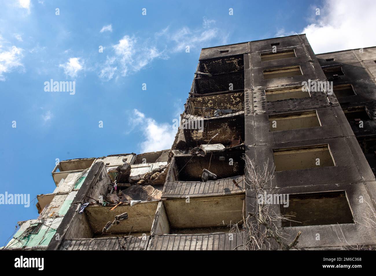 Russian bomb hit civilian buildings. War in Ukraine, ruined building ...