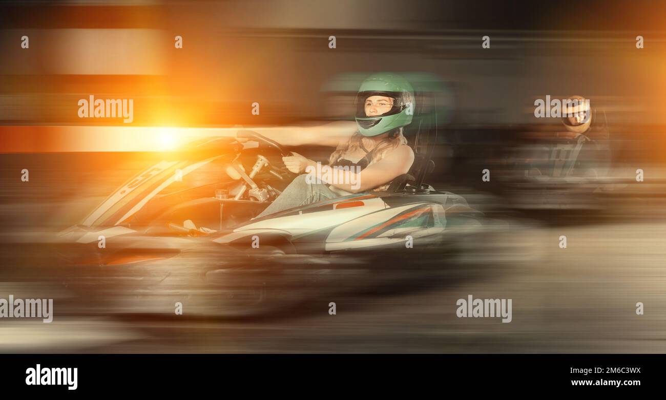 woman driving racing car at kart circuit Stock Photo - Alamy