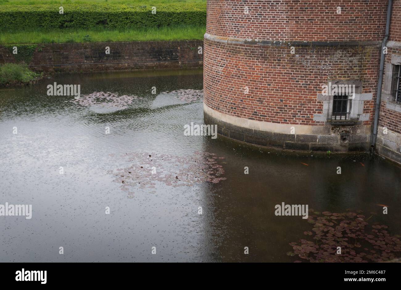 A moat around a medieval castle filled with water Stock Photo - Alamy