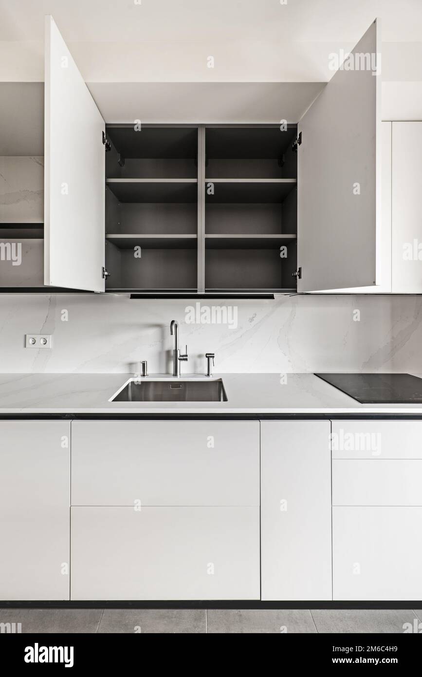 Frontal image of a modern design kitchen with smooth handleless ...