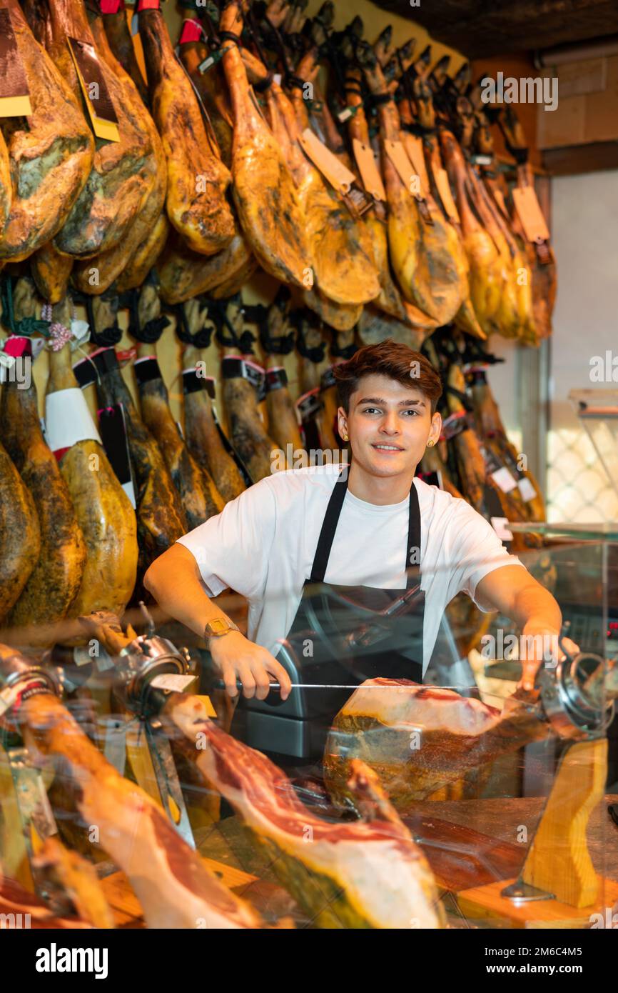Positive butcher cutting meat hi-res stock photography and images - Alamy