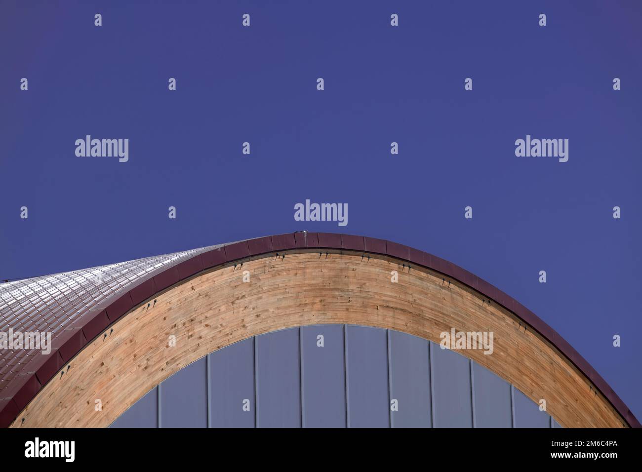 Semicircular modern design roof built with three materials, wood, glass ...