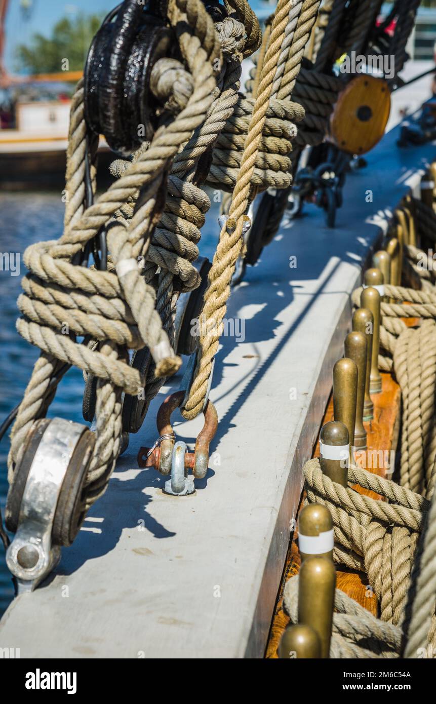Rigging on the old sailboat against the background of modern yachts ...