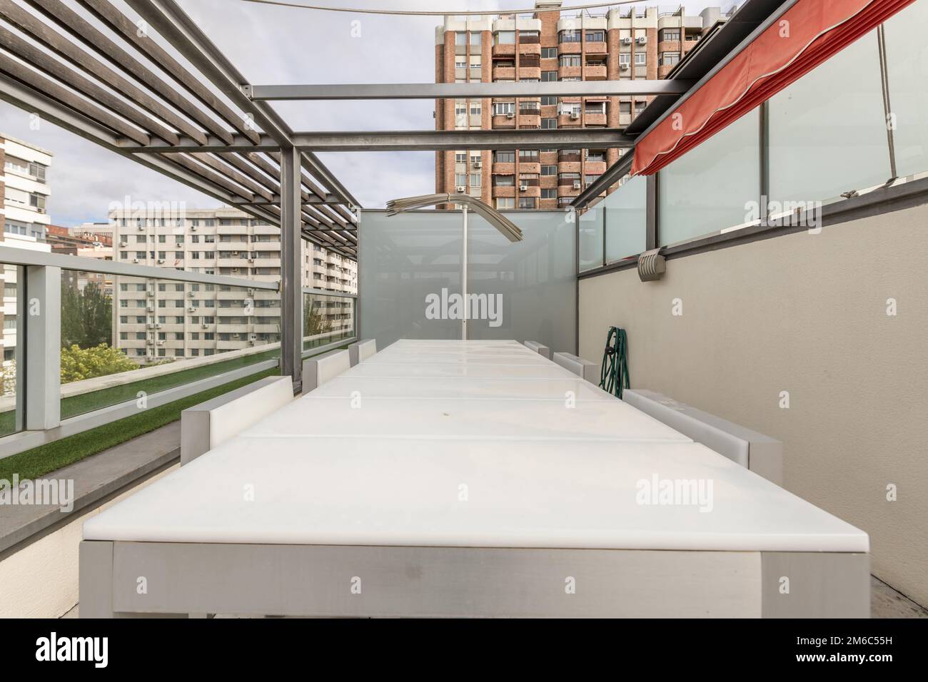 Community penthouse terrace of an urban residential building with ...