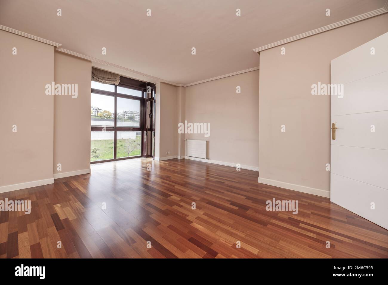 Large empty living room of a house with wooden floors, built-in ...