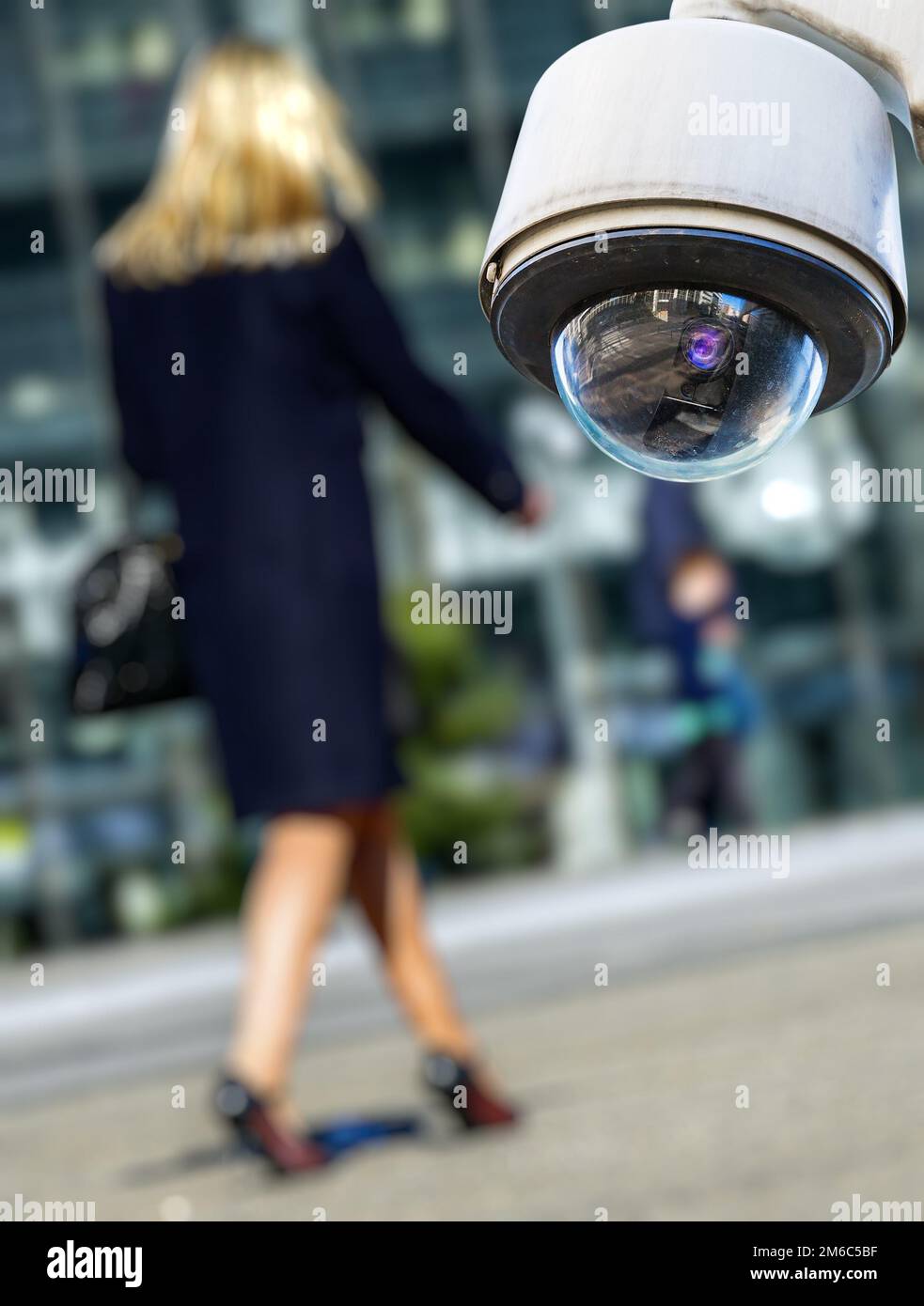 Security CCTV camera or surveillance system with woman on blurry ...