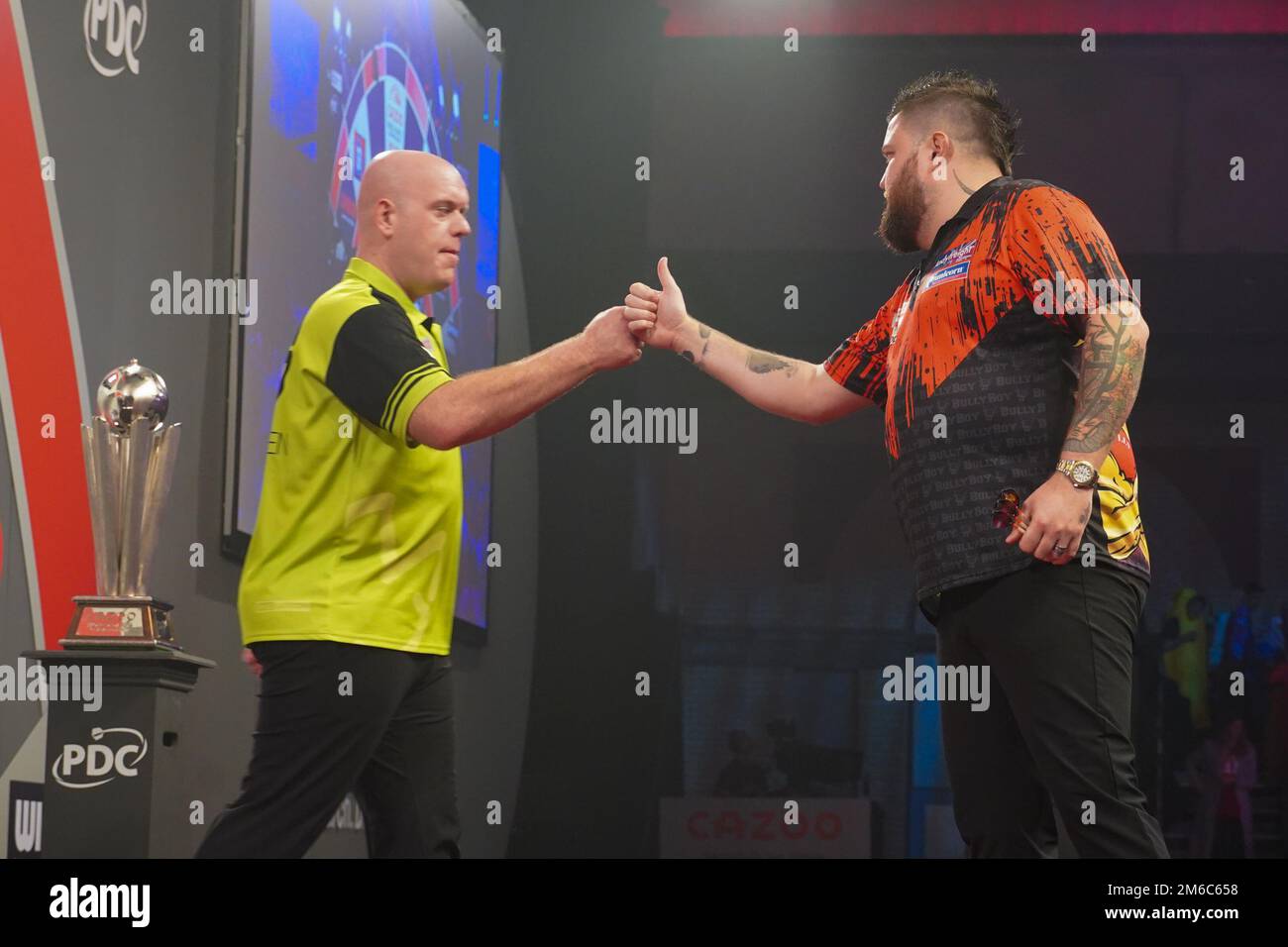 LONDON, UNITED KINGDOM - JANUARY 3: Michael Smith of England and Michael van Gerwen of the ...