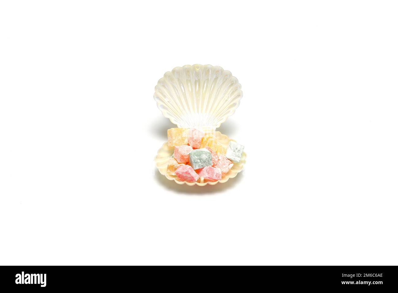 Colorful Turkish Delight in oyster shells. isolated on white background ...