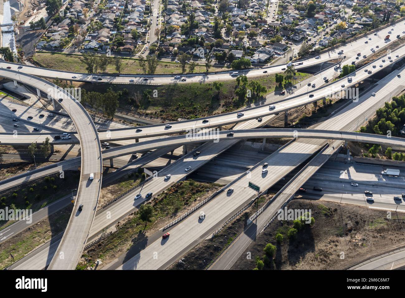 Aerial down view of the Interstate 5 and Route 118 freeway interchange ...