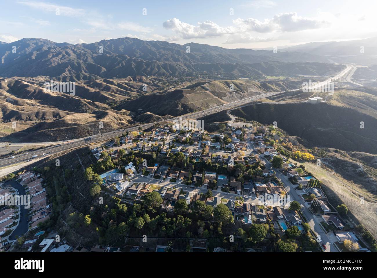Aerial view of suburban hilltop homes and the San Gabriel Mountains ...
