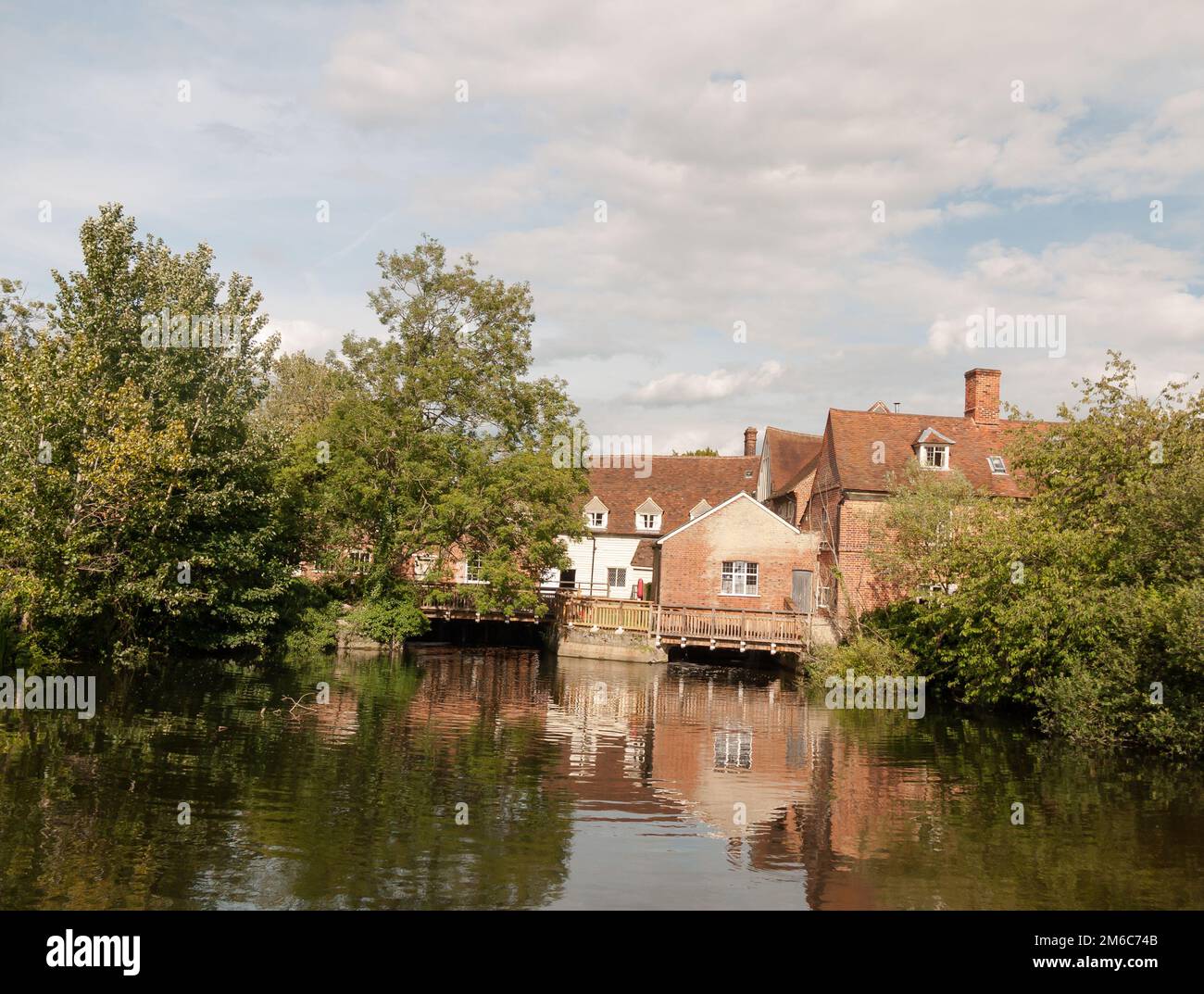 A river cottage scene in summer light in flatford mill near dedham in ...