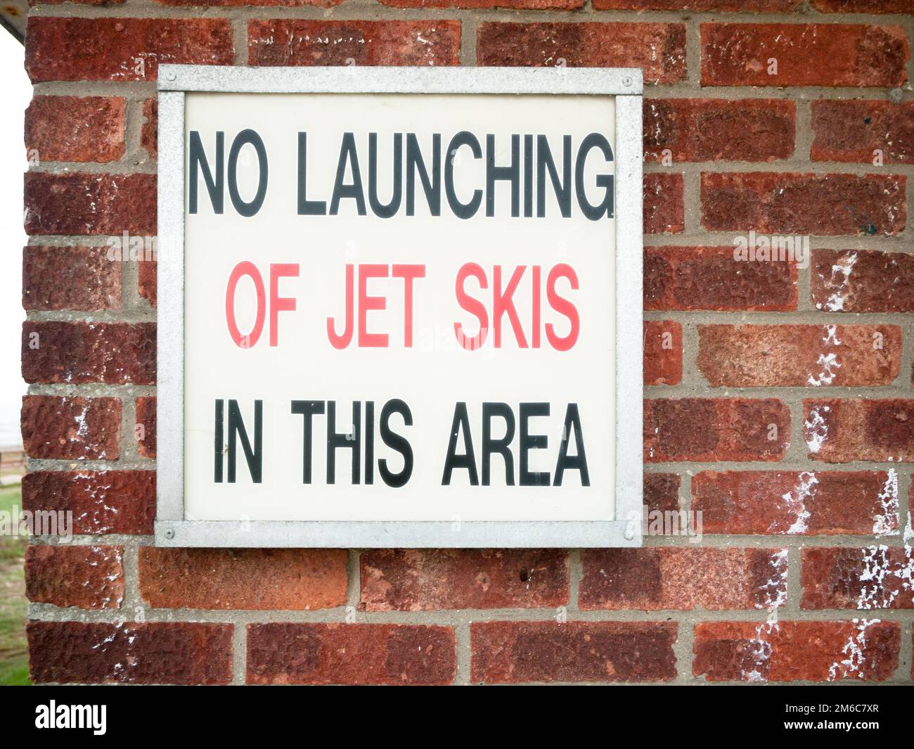 Old retro sign lettering on wall saying no launching of jet skies in ...