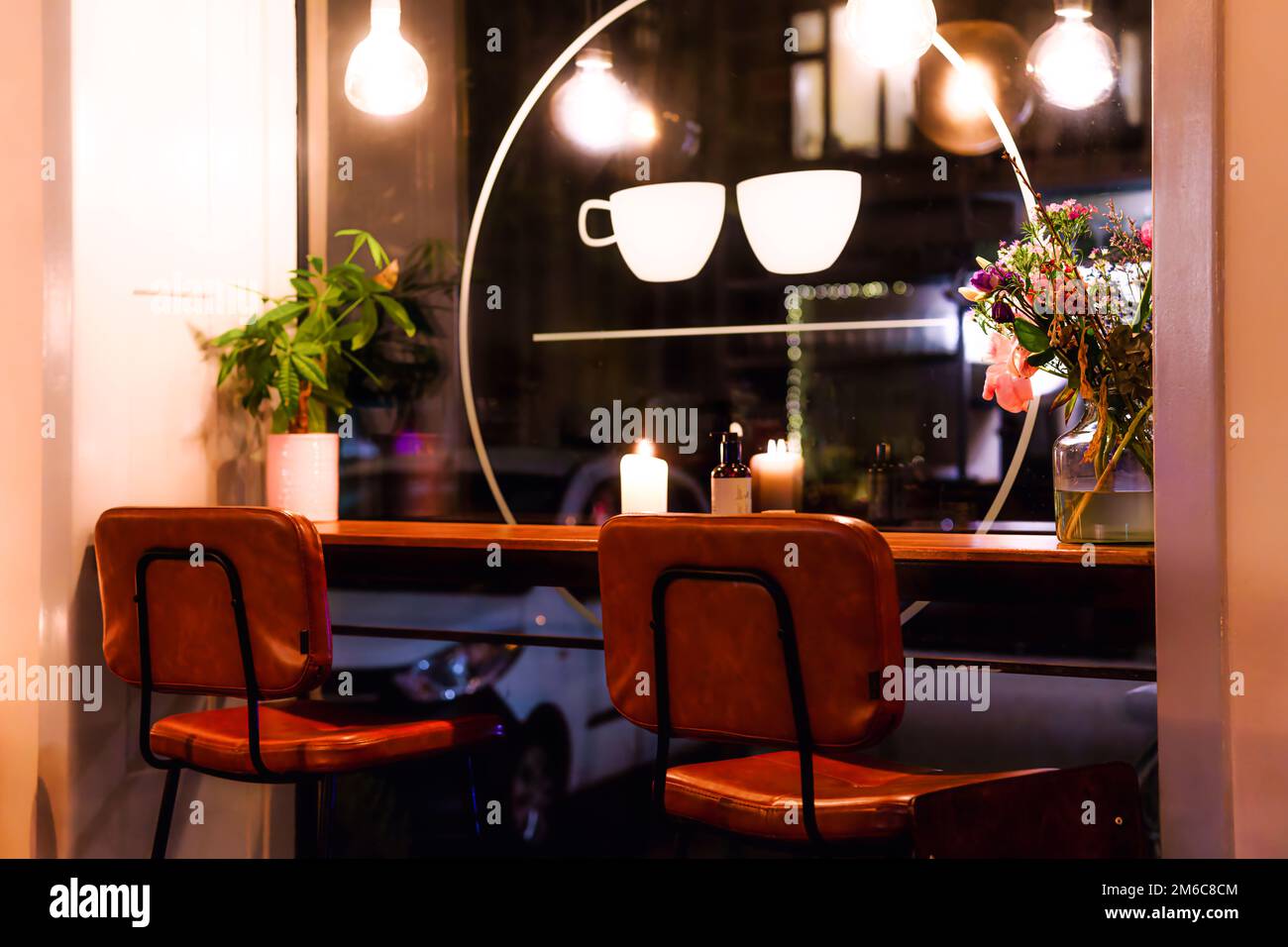 A counter bar table by the glass window at a coffee shop, cafe with a ...