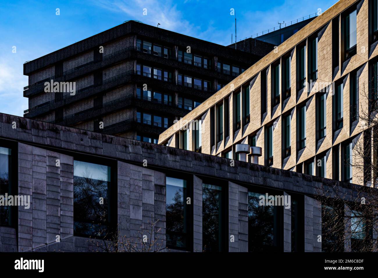 The beautiful modern architectural stone buildings in grey against the ...