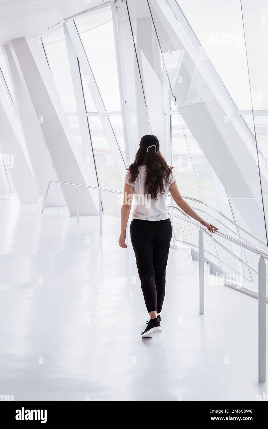 Woman walking on modern hi-res stock photography and images - Alamy