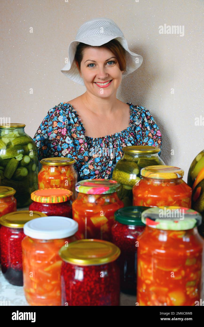 Cheerful housewife with homemade canned food Stock Photo - Alamy