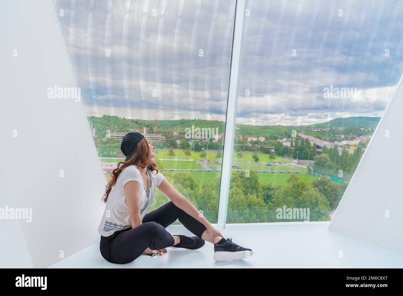 Woman sits on window hi-res stock photography and images - Alamy