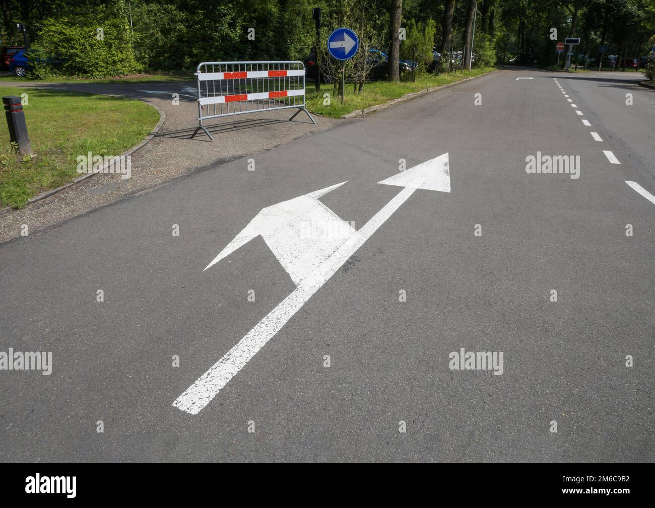 Road sign, lane markings - Straight ahead and turn to the left closed ...