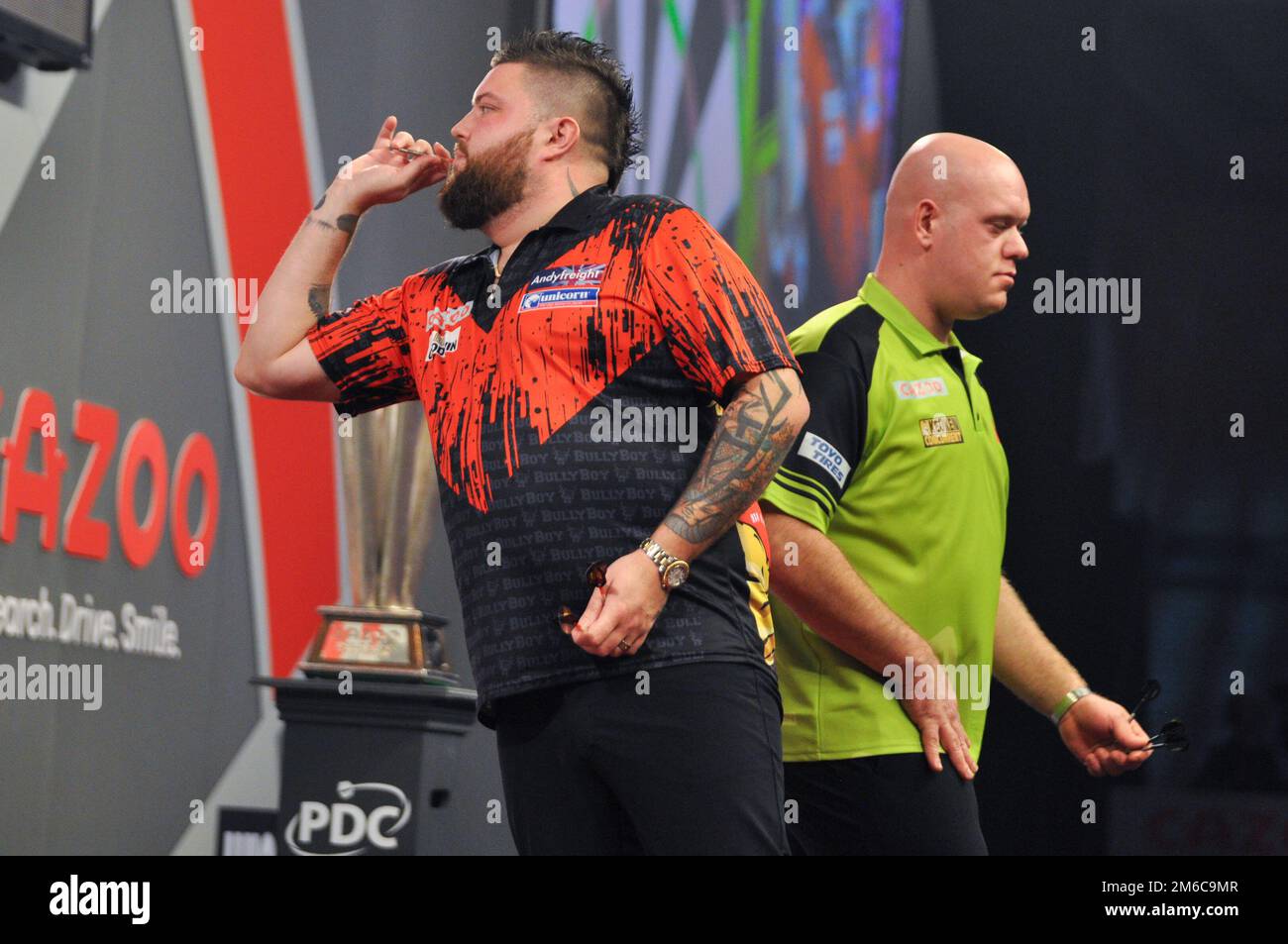 LONDON, UNITED KINGDOM - JANUARY 3: Michael Smith of England and MIchael van Gerwen of the ...