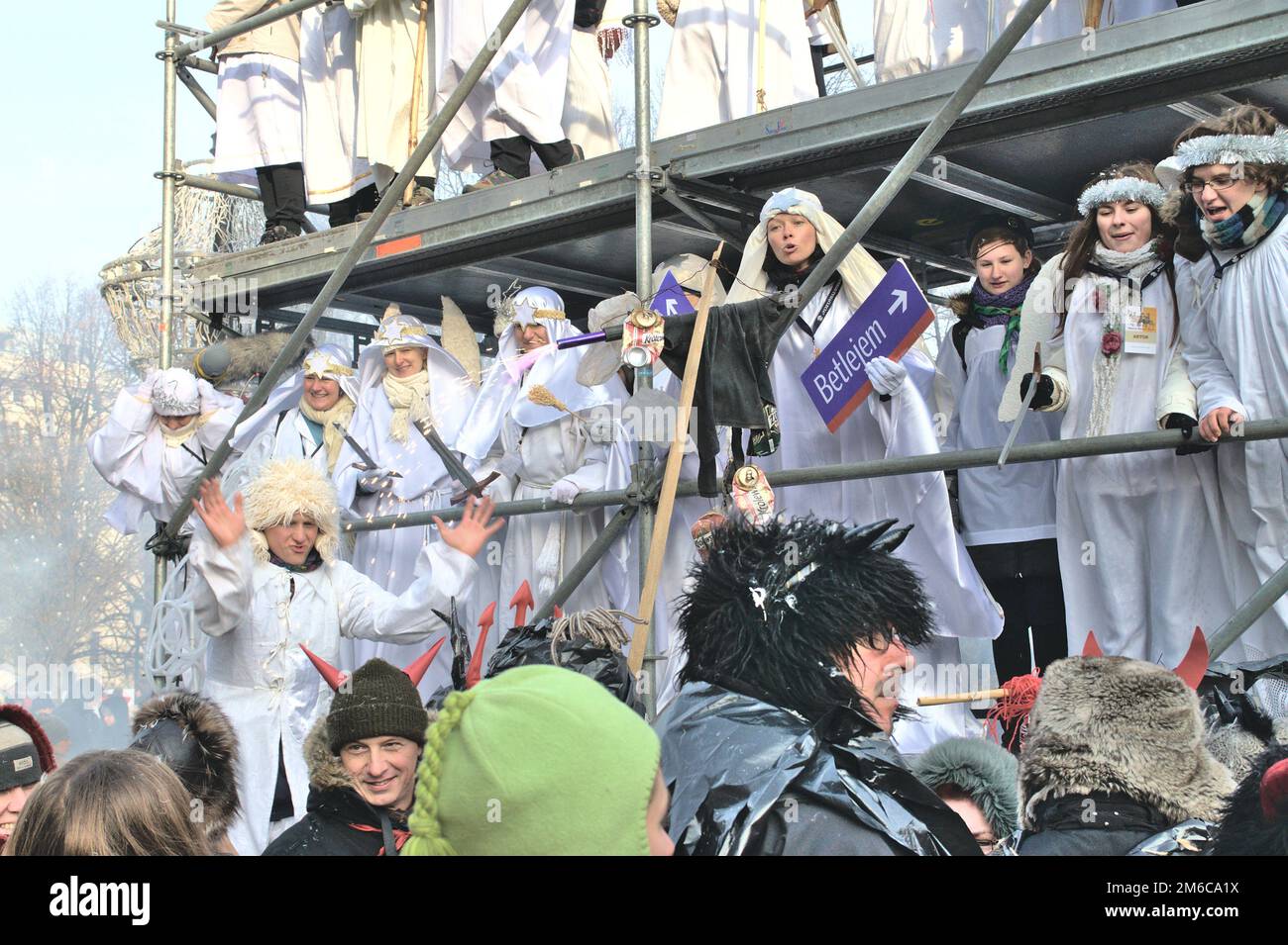 A volunteers dressed as angels during the annual Three Kings Day Parade ...