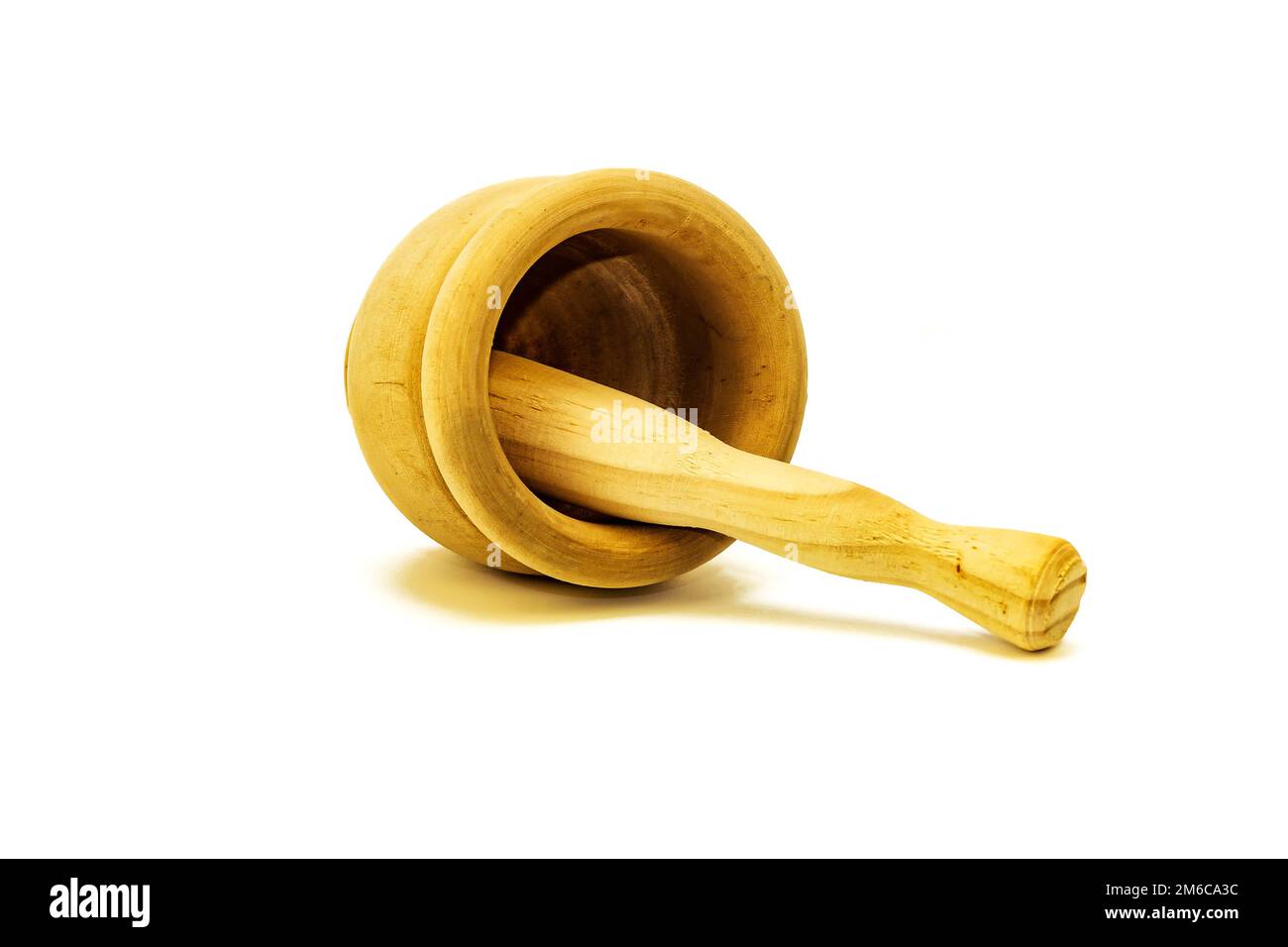 On a white background a wooden mortar for grinding various culinary ...