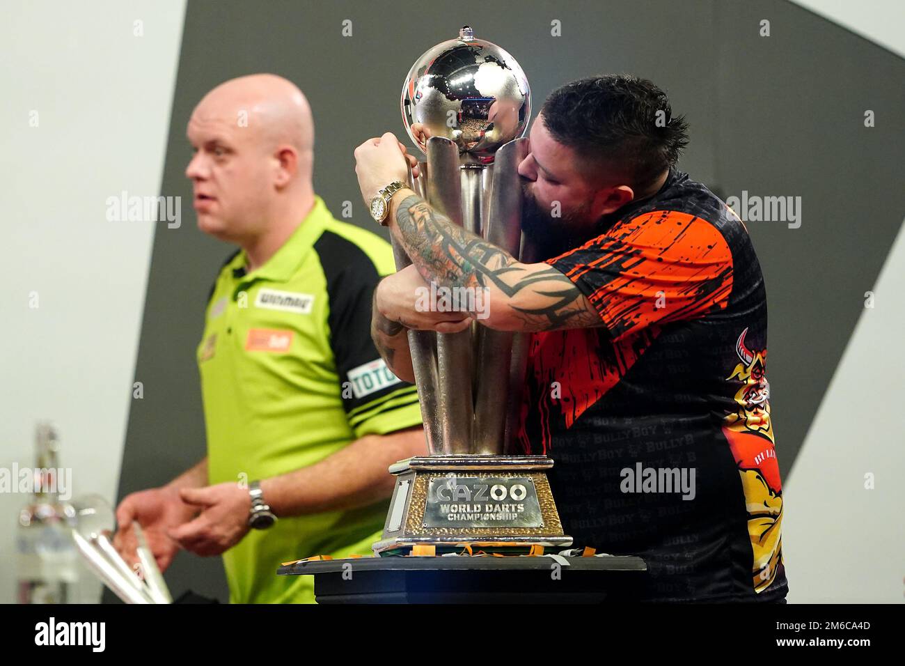 Michael Smith celebrates with the Sid Waddell trophy after winning the ...