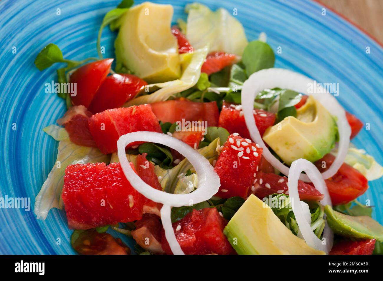 Salad with watermelon, avocado, grapefruit Stock Photo - Alamy