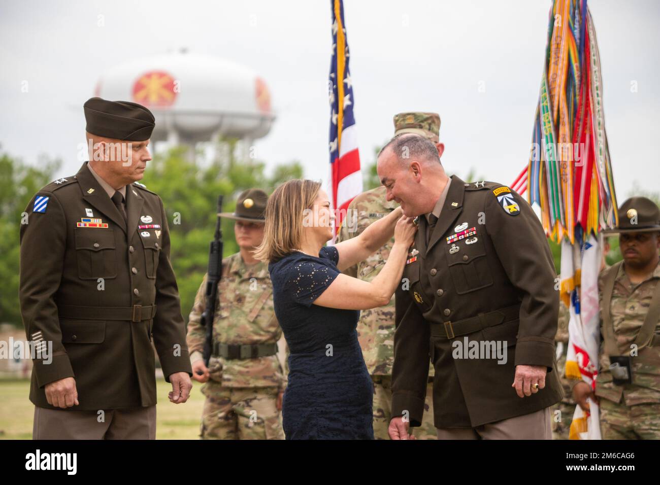 Tracey Rafferty, center pins her husband’s, Maj. Gen. John Rafferty ...