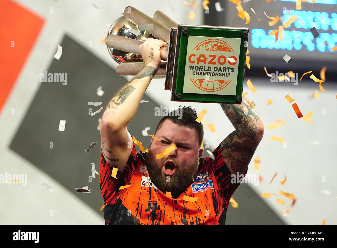 Michael Smith celebrates with the Sid Waddell trophy after winning the ...