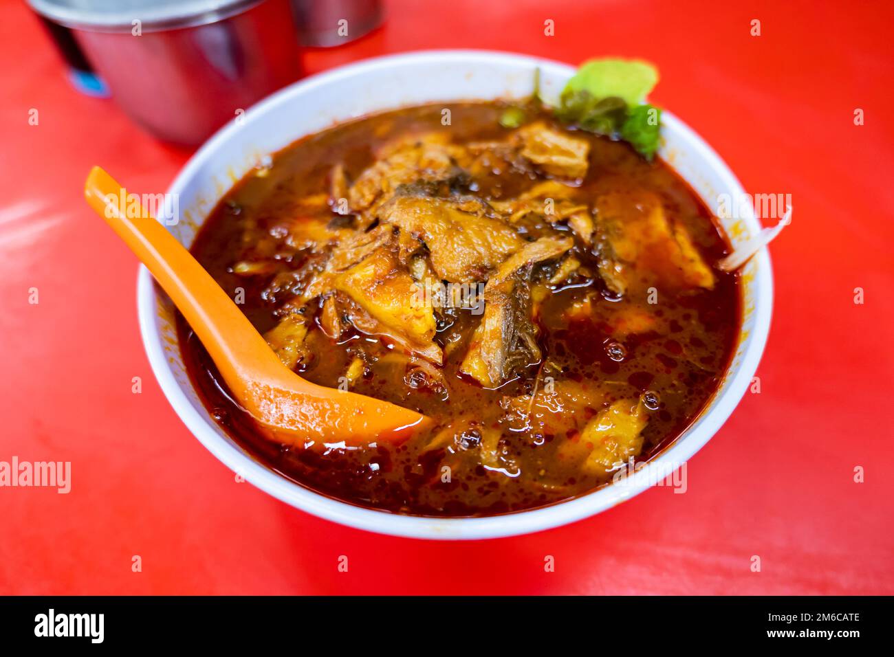 Laksa, famous noodle dish in Malaysia and Singapore, served in street ...